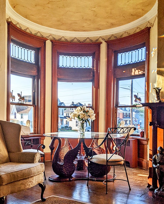 A bay window alcove where swan-shaped chairs cradle you as you sip morning coffee and watch small-town Ohio life unfold outside.