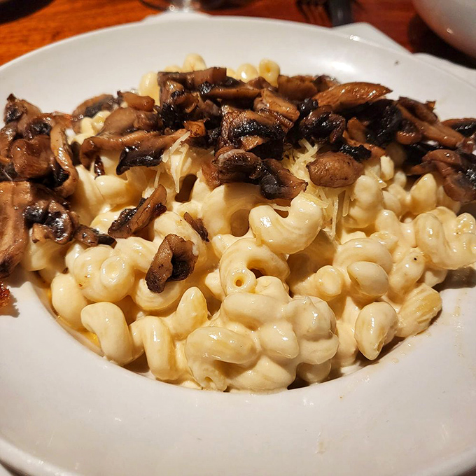 Someone had the brilliant idea to add mushrooms to the already legendary mac and cheese. Like putting a hat on the Mona Lisa—unnecessary but delightful.