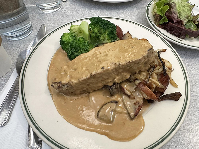 The meatloaf here doesn't just sit on the plate&mdash;it commands it, surrounded by a moat of mushroom gravy that you'll want to swim in.