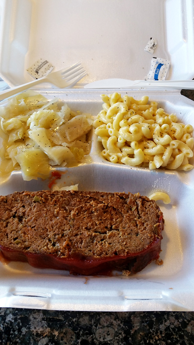 The perfect meat-and-three harmony: meatloaf conducting an orchestra of mac and cheese and cabbage, with no fancy garnishes stealing the spotlight.