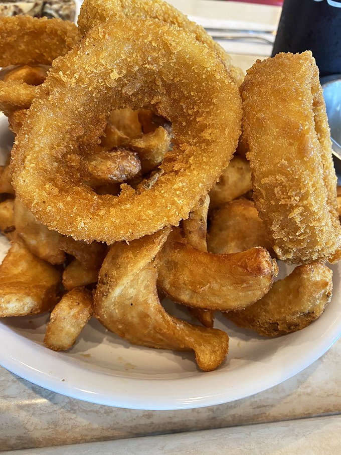 These aren't just onion rings; they're golden halos of crispy perfection that make you question why anyone would ever eat onions any other way.
