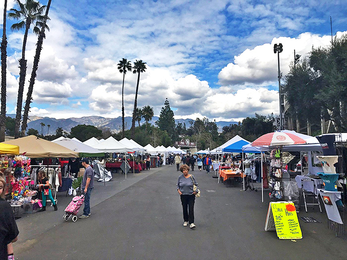 Rows of white tents stretch toward the San Gabriel Mountains, creating a temporary city where the currency is curiosity and the national sport is bargaining.