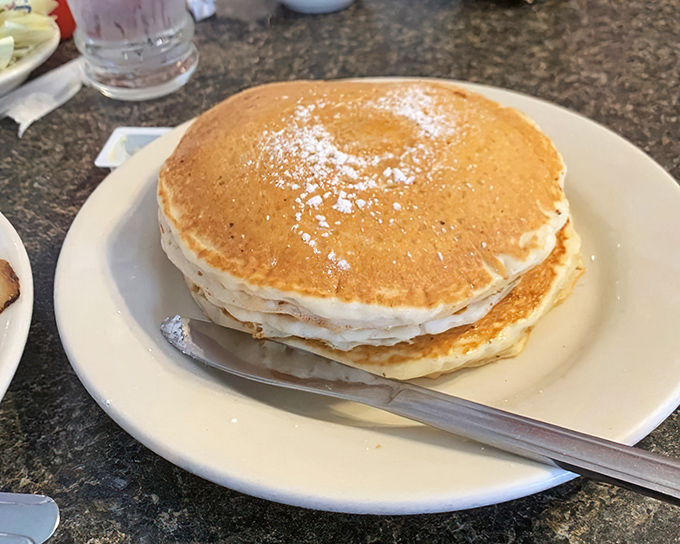 Behold the tower of power&mdash;three perfectly stacked pancakes that could double as frisbees. Your diet doesn't stand a chance.