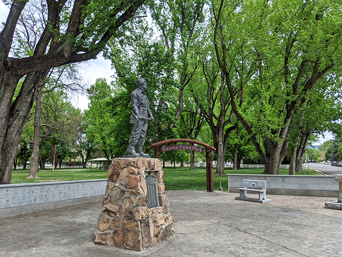 Town Park's statue stands as a silent witness to generations of community gatherings, picnics, and the occasional impromptu guitar session.