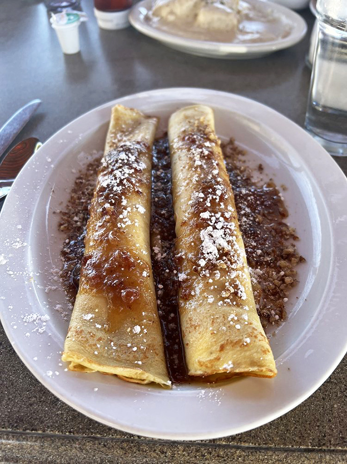 These crepes aren't just breakfast, they're an event. Dusted with powdered sugar and drizzled with syrup&mdash;morning decadence at its finest.