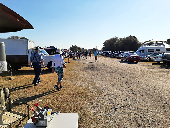 The pilgrimage begins along dusty pathways between vendors. Like modern-day explorers, these shoppers scan the horizon for that perfect find.