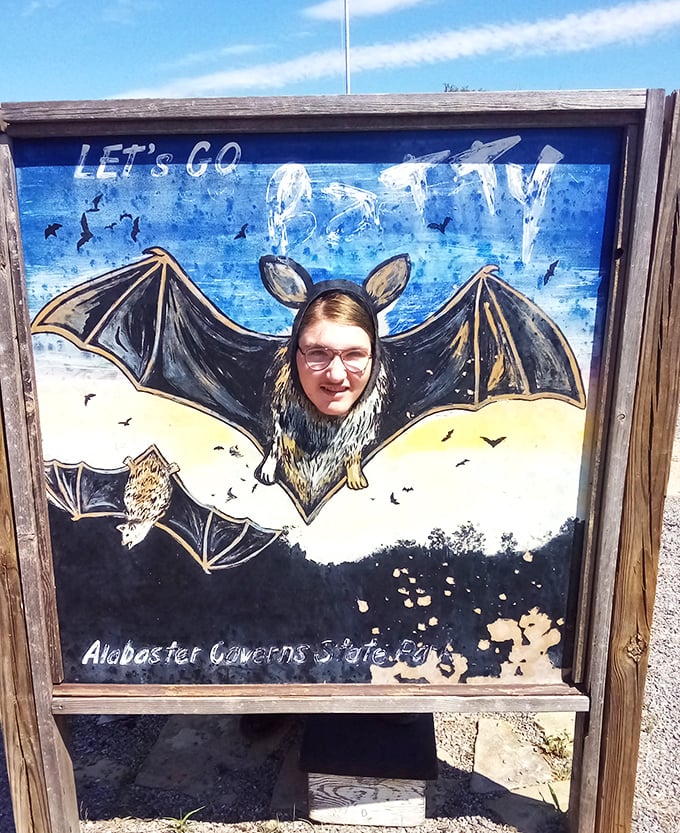 Who says bats can't be photogenic? This playful photo cutout lets visitors embrace their inner cave-dweller before exploring the real habitats below.