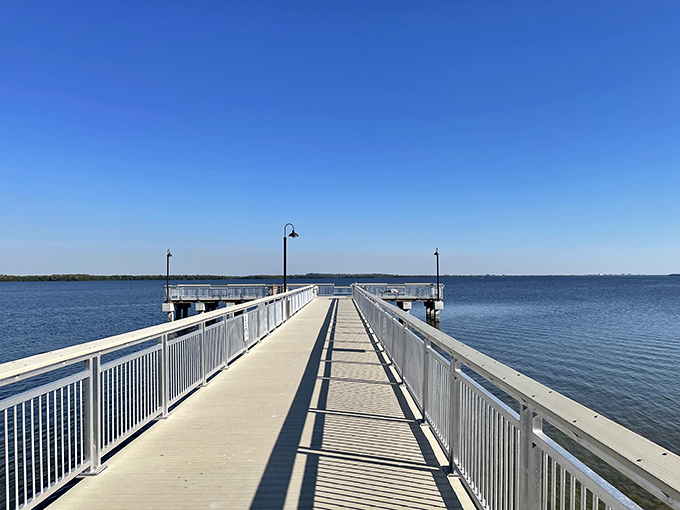 This fishing pier stretches toward forever, offering the perfect stage for both sunrise contemplation and sunset celebration.