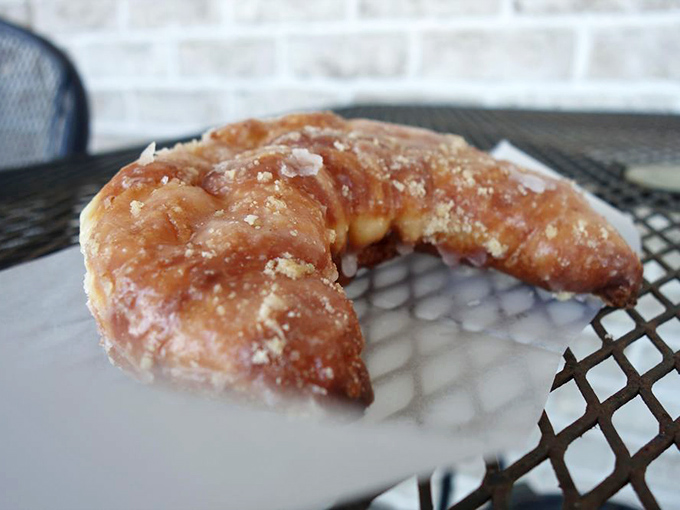That glistening, sugar-dusted crescent isn't just a pastry&mdash;it's edible architecture. Flaky, buttery, and guaranteed to leave evidence on your shirt.