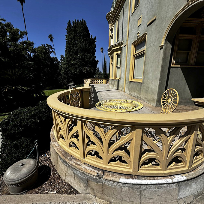 This curved balcony with its leaf-patterned railings offers the perfect perch for sipping tea and pretending you're in an Edith Wharton novel.
