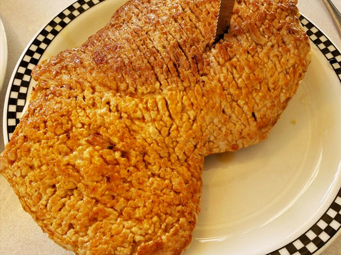 Not all pork tenderloins are created equal. This golden masterpiece has the perfect crunch-to-meat ratio—a Hoosier handshake on a plate.