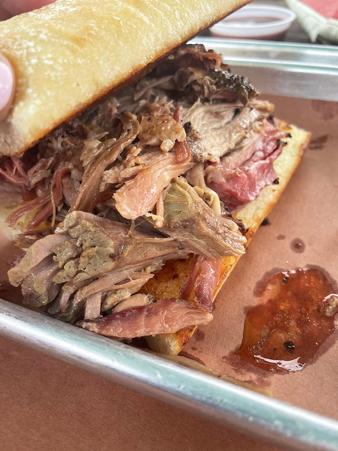 A pulled pork sandwich that doesn't skimp on the good stuff&mdash;tender strands of smoky pork piled high enough to make your cardiologist wince and your taste buds rejoice.