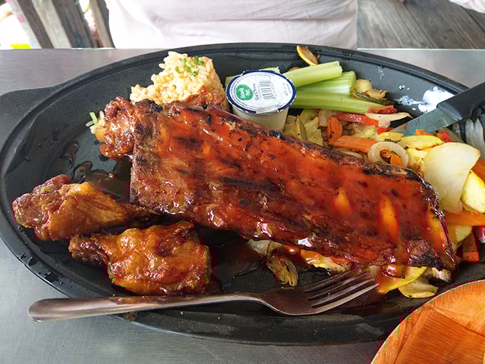 Fall-off-the-bone ribs served with a side of vegetables that somehow make you feel virtuous while indulging in barbecue bliss.