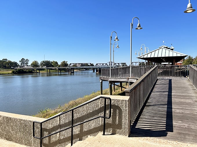 The riverfront boardwalk offers peaceful views and contemplative moments, proving sometimes the best entertainment doesn't require a credit card swipe.