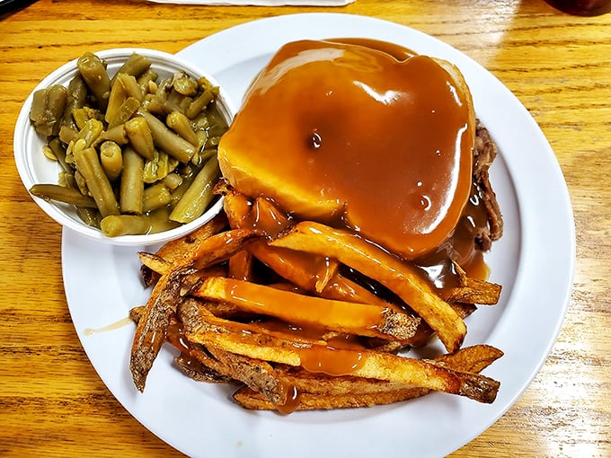This isn't just gravy—it's liquid happiness cascading over homestyle roast beef and fries. Napkins required, restraint optional.