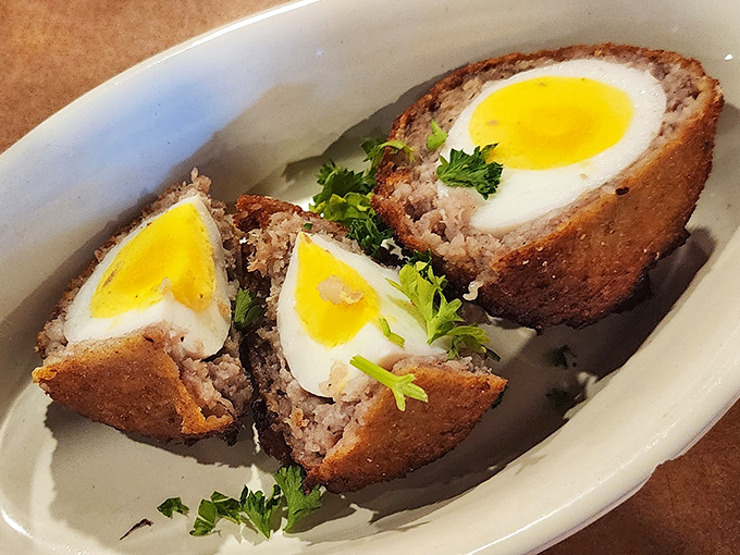 Scotch eggs: where breakfast meets engineering marvel. A perfectly cooked egg wrapped in sausage and breadcrumbs &ndash; Britain's gift to protein lovers everywhere.