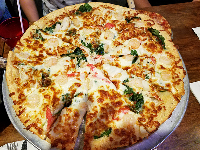 This seafood pizza isn't just a meal, it's a statement. Fresh ingredients arranged with the care of an artist who knows their canvas is edible.