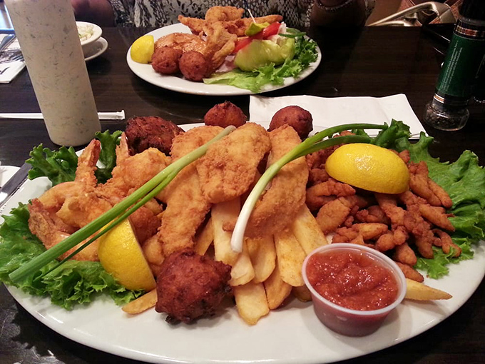 The seafood platter that launched a thousand road trips. Those hushpuppies are the unsung heroes of this oceanic feast.