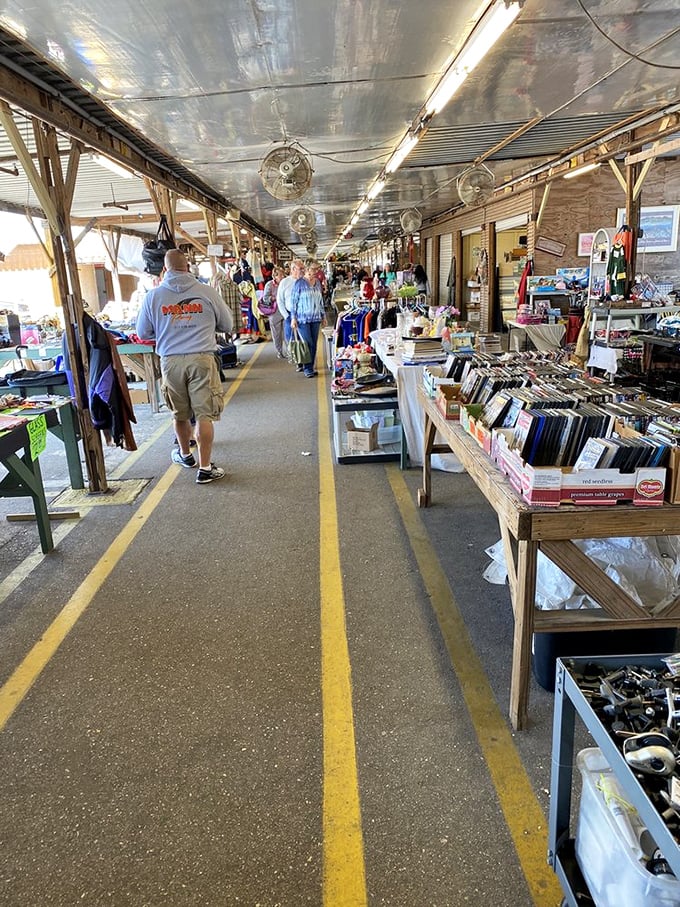 The yellow-lined pathways serve as shopping highways where browsers and serious collectors alike navigate through a sea of potential treasures.