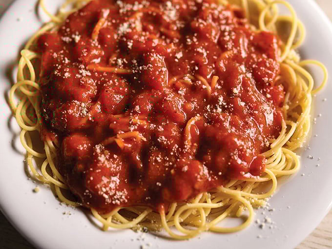 The star of the show: spaghetti with meat sauce that somehow manages to taste like it's been simmering all day, topped with a snowfall of parmesan that melts just right.