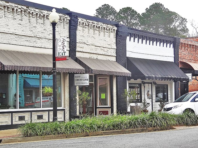 These storefronts with their classic awnings remind me that sometimes the best shopping experiences don't need escalators, just genuine character and hometown pride.