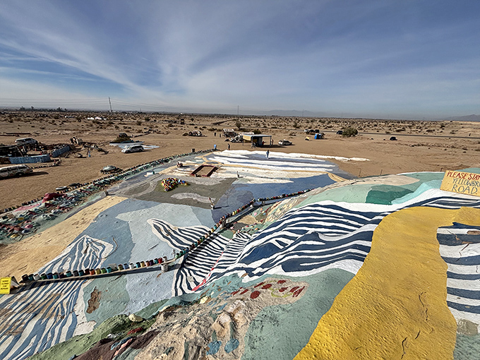 The view from above reveals Salvation Mountain's true scale&mdash;a patchwork quilt of color stretched across the desert floor like an artistic oasis.