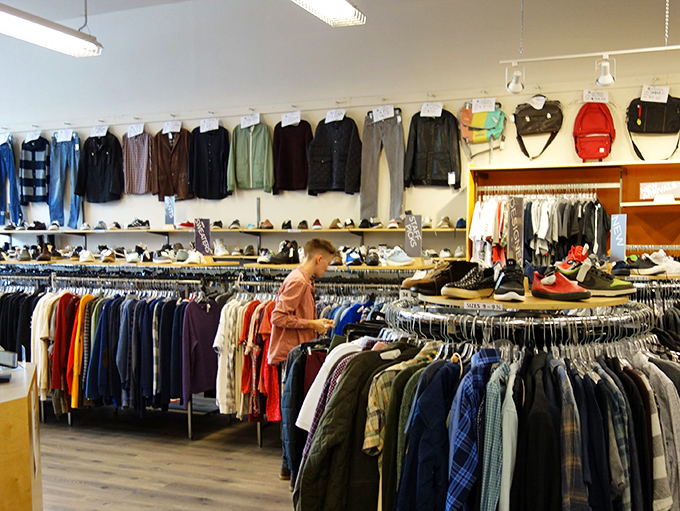 Serious browsing in progress. The men's section offers everything from casual weekend wear to office-appropriate button-downs that look barely worn.