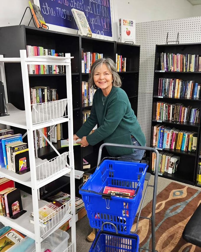 The book section attracts dedicated hunters armed with blue baskets and the patience of literary archaeologists excavating for that perfect paperback find.