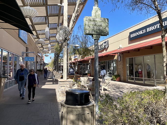 Sun-dappled walkways guide shoppers between storefronts, where Brooks Brothers neighbors casual eateries in this retail community.