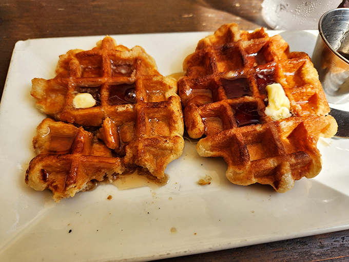 These golden beauties represent waffle perfection &ndash; crispy outside, fluffy inside, and absolutely worth planning your entire day around.