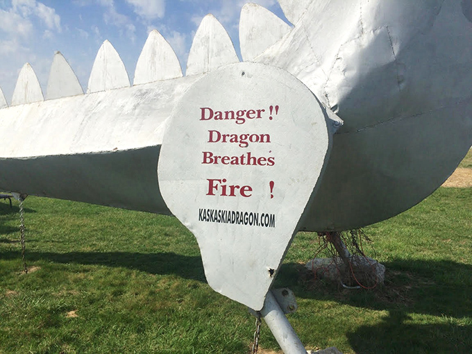 Fair warning: this isn't your average roadside photo op. The sign's straightforward message perfectly captures the dragon's no-nonsense Midwestern attitude.