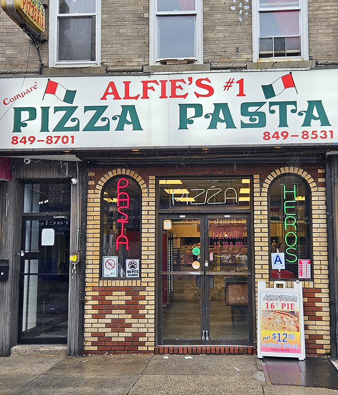 Alfie's bold sign demands you "Compare" their pizza. That's confidence you can taste in every bite.