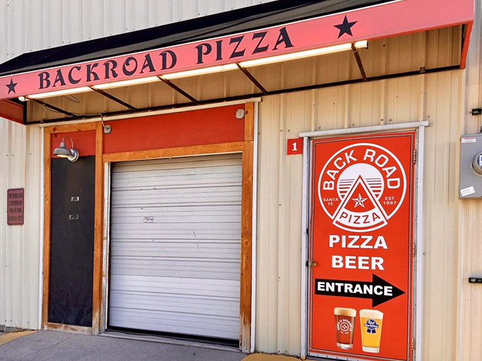 Back Road Pizza's outdoor oasis feels like stumbling into the secret garden of carbs. Those mismatched chairs have hosted countless pizza epiphanies.