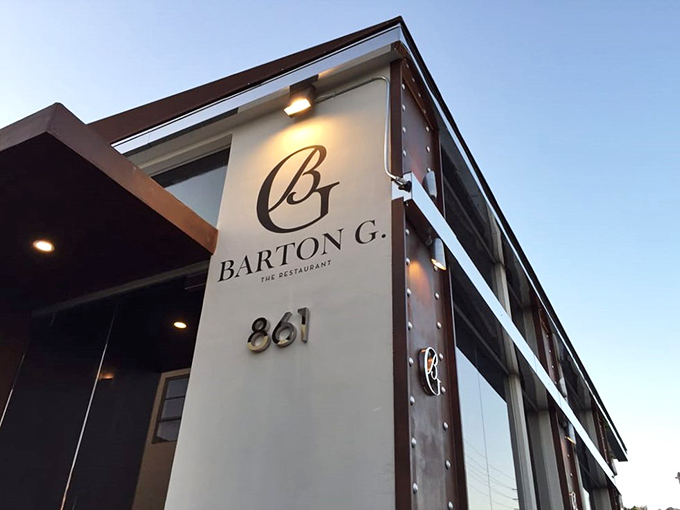 Barton G: Sleek, modern, and ready for its close-up. This understated entrance hides the theatrical food presentations waiting inside.