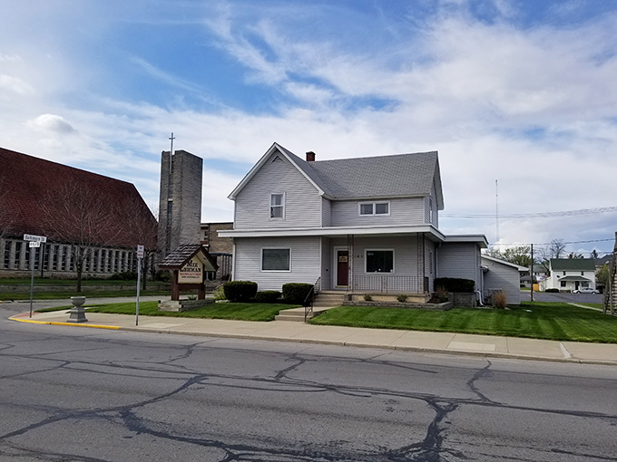 A simple white house in Berne &ndash; where front porches still serve as social media and neighbors actually talk.