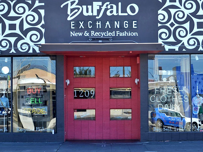 Buffalo Exchange's bold facade pops with personality! That vibrant red door practically dares you to discover vintage fashion gold.