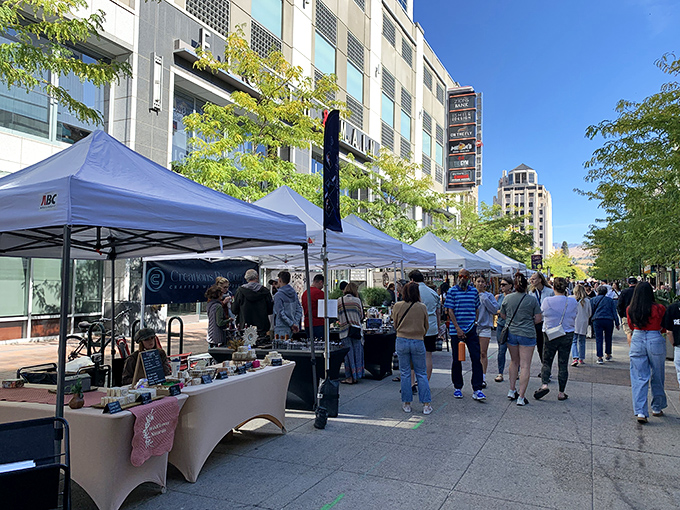 Urban market magic in downtown Boise. White tents transform city streets into a shopper's paradise.