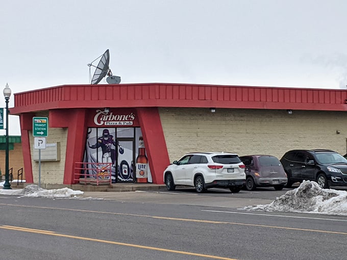 Carbone's Pizza & Pub: That vibrant red building stands out like a beacon of pizza promise. You can practically smell the melting cheese from the parking lot.