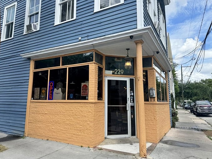 D'Allesandro's blue and yellow corner building stands like a beacon of pizza hope in Charleston's historic streets.