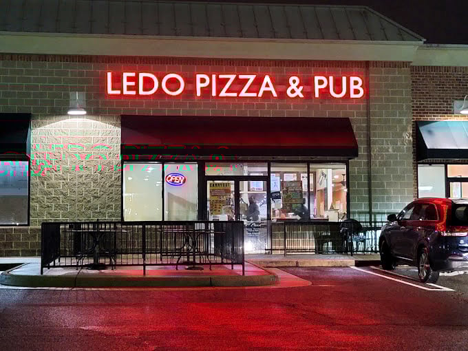 Ledo Pizza's glowing red sign cuts through the night like a beacon for rectangular pizza pilgrims.