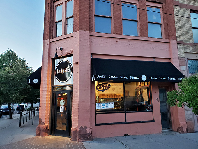 Lucky Slice's corner spot brings vibrant pink charm to historic downtown Ogden. If buildings could wink, this one would!