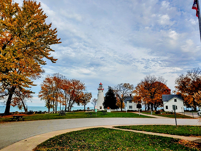 Marblehead Lighthouse State Park: "Sentinel in scarlet and white. This lighthouse has been photobombing family vacation pictures since before cameras existed."