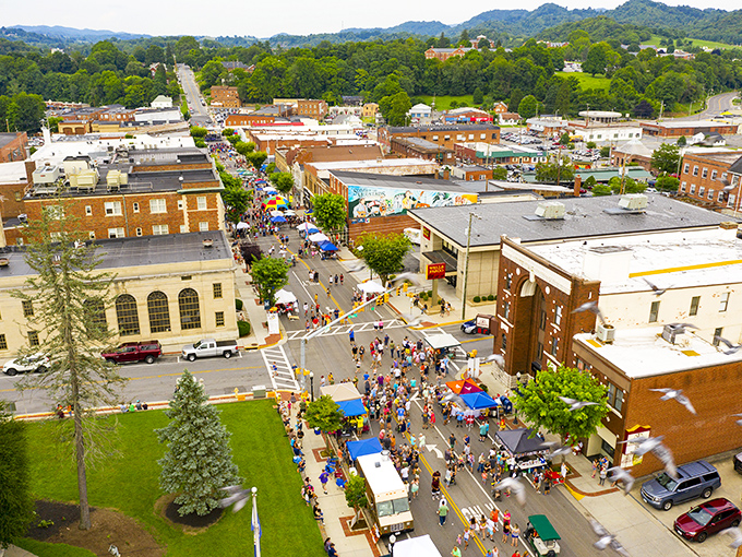 Lively festival crowds in Marion welcome you to explore colorful tents, delicious food trucks, and a vibrant atmosphere from above.