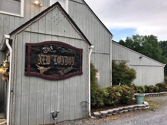 The New London House's rustic wooden sign promises no-frills excellence. Sometimes the best steaks hide in the most unassuming places.