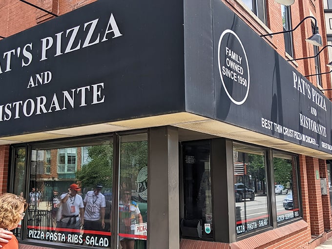 Pat's black awning announces its pizza confidence without shouting – in Chicago, legends don't need to brag.