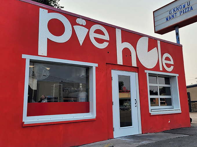 Pie Hole's fire-engine red building doesn't whisper, it shouts! Like that friend who's loud but always brings the best snacks to the party.