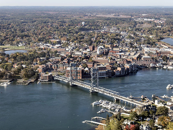 Portsmouth's waterfront buzzes with activity as colorful buildings line the Piscataqua River. A postcard-perfect New England seaport!