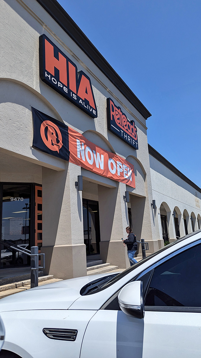 "Hope Is Alive" indeed at Retreads Thrift, where shopping with purpose meets unexpected style. That balloon arch is just the beginning!