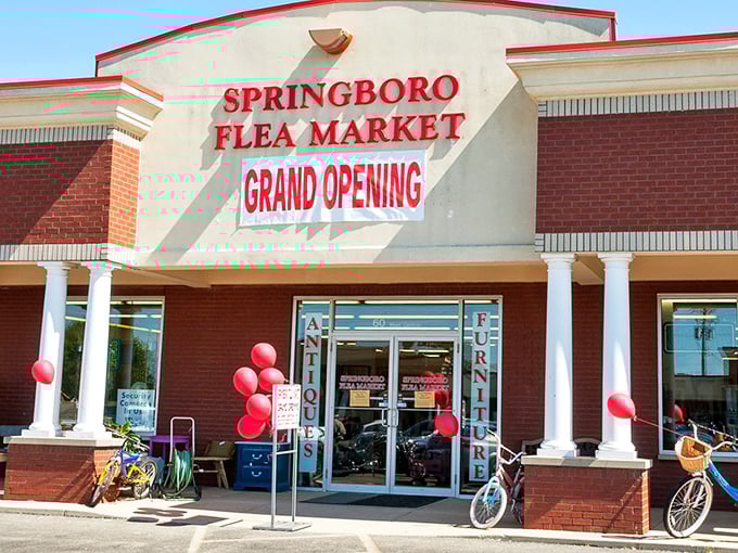 Springboro Flea Market's grand opening sign and festive red balloons promise new adventures in bargain hunting.