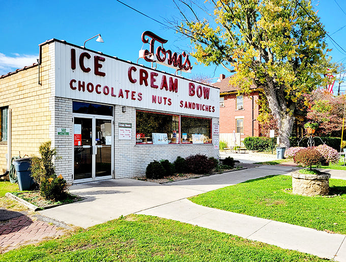 Tom's Ice Cream Bowl stands proud with its vintage sign promising four essential food groups: ice cream, chocolates, nuts, and sandwiches.